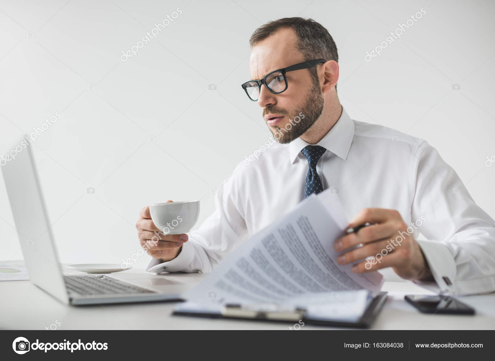 Businessman doing paperwork Stock Photo by ©TarasMalyarevich 163084038 Businessman doing paperwork Stock Photo by ©TarasMalyarevich 163084038
