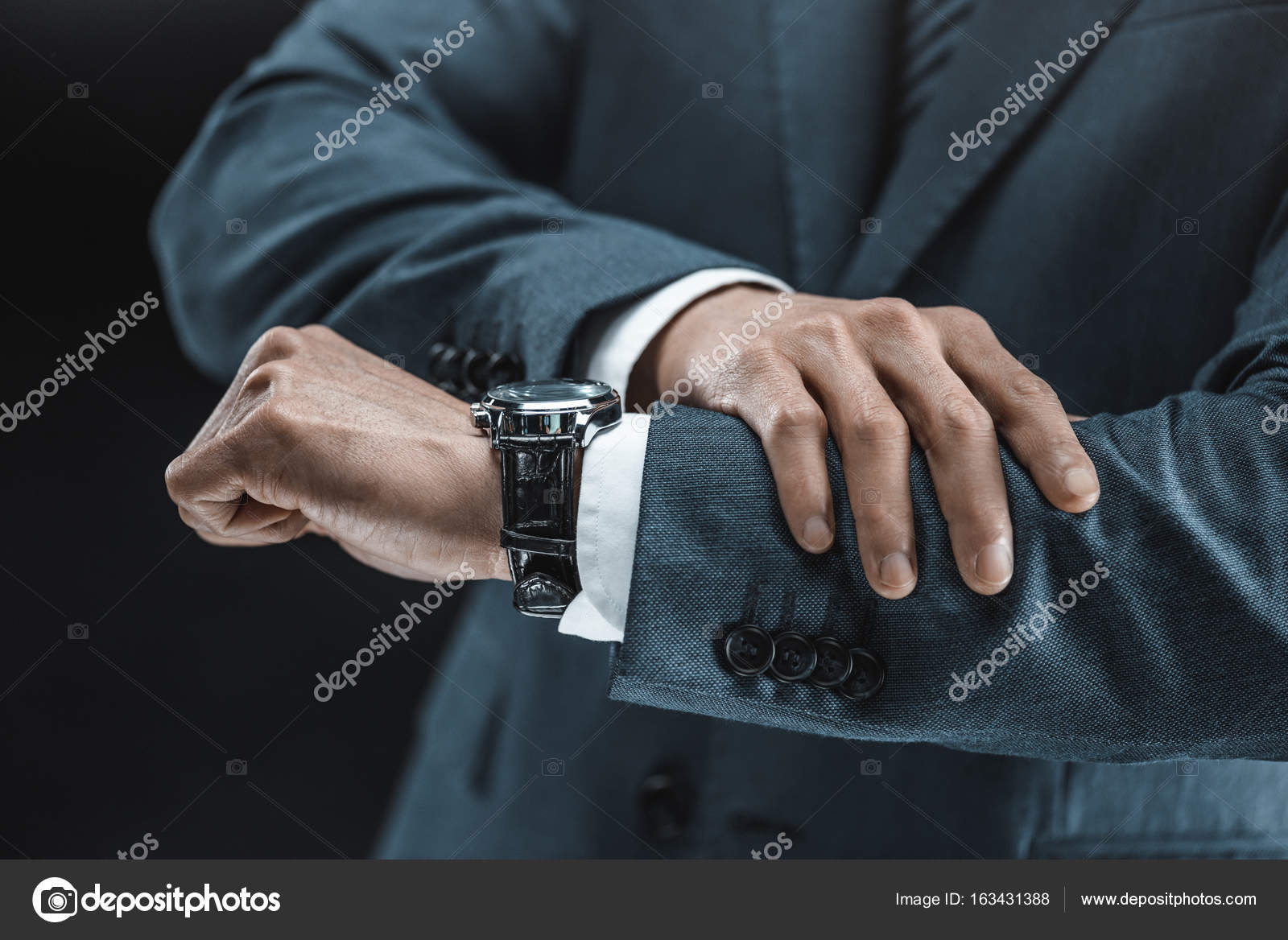 Businessman checking time — Stock Photo © TarasMalyarevich #163431388