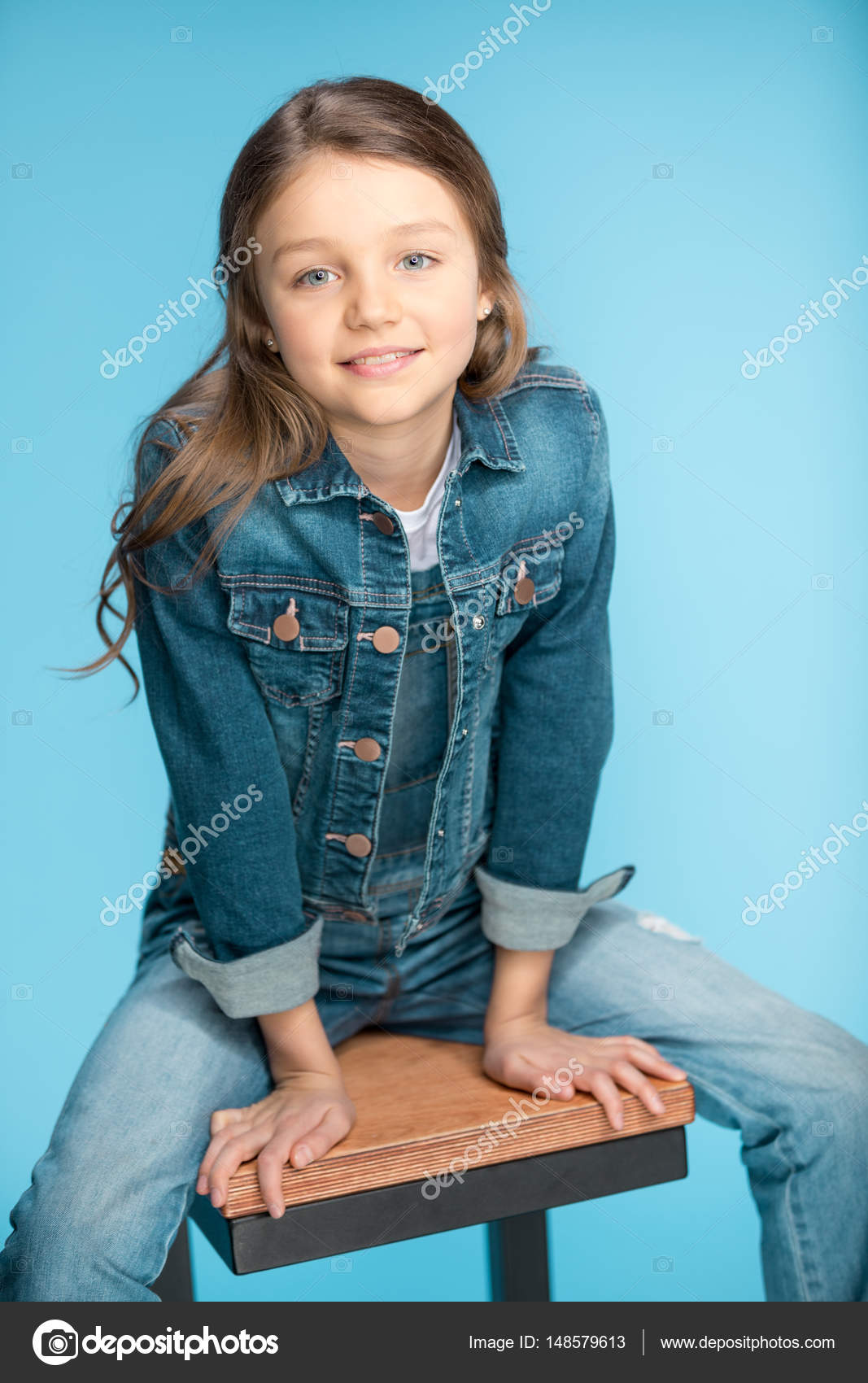 Girl sitting on stool Stock Photo by ©AndreyBezuglov 148579613
