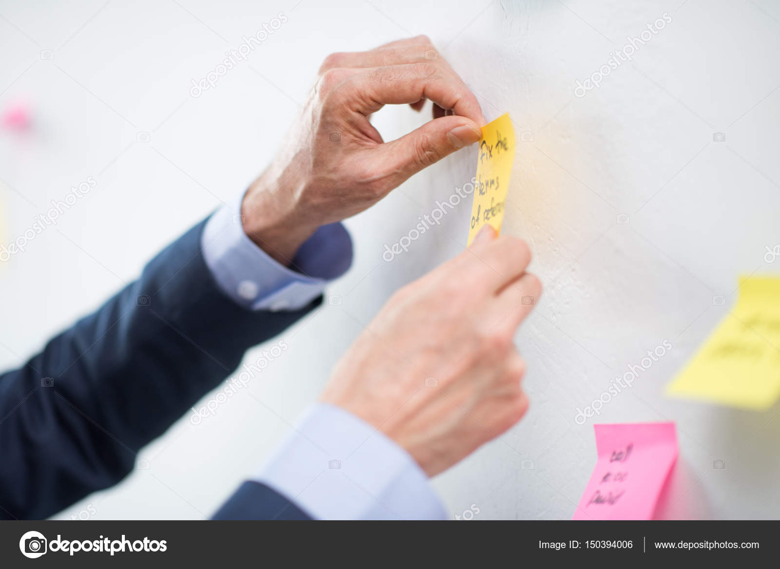 Businessman putting sticker on board — Stock Photo © AndreyBezuglov ...