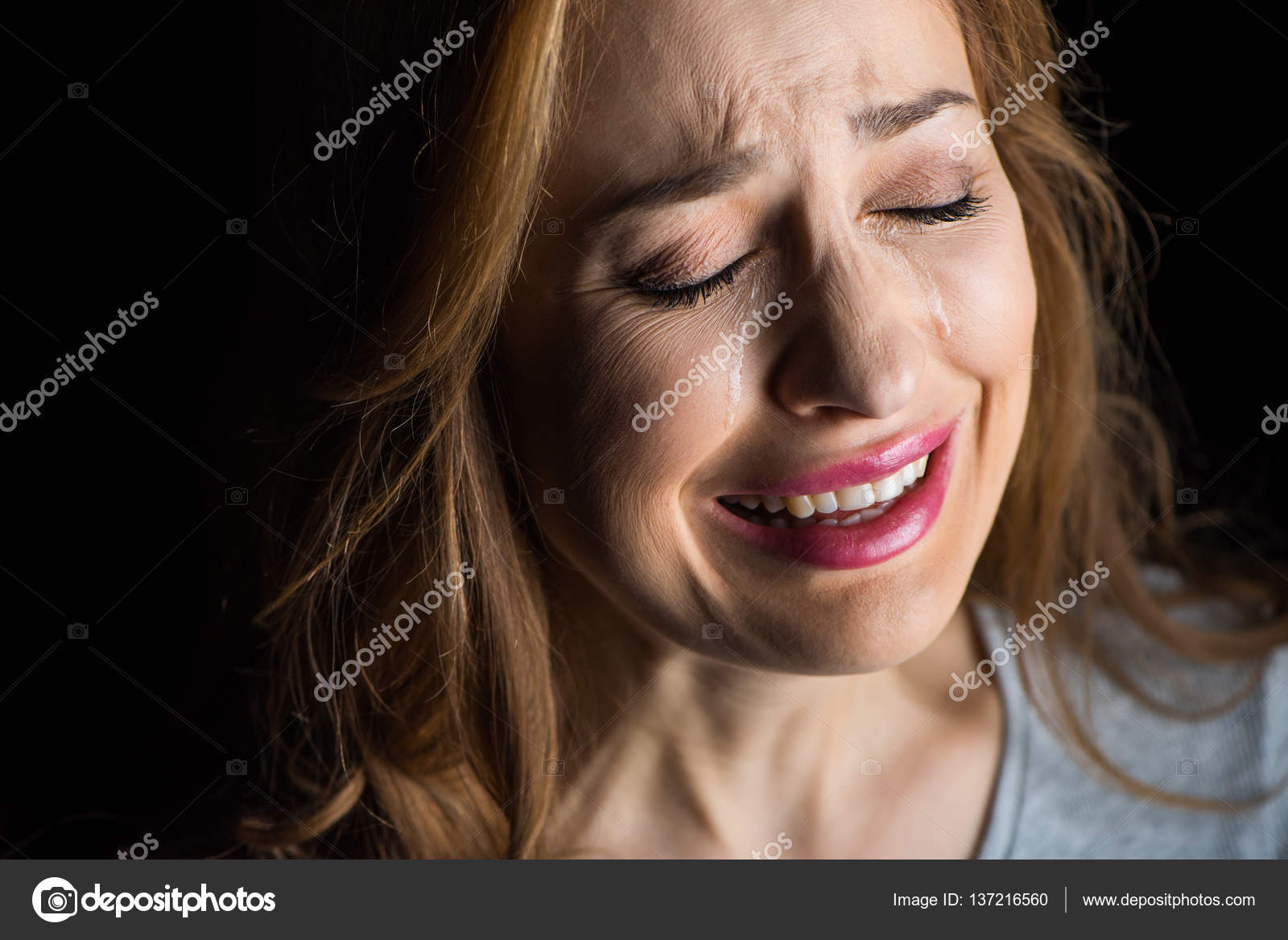 Young woman crying Stock Photo by ©IgorTishenko 137216560