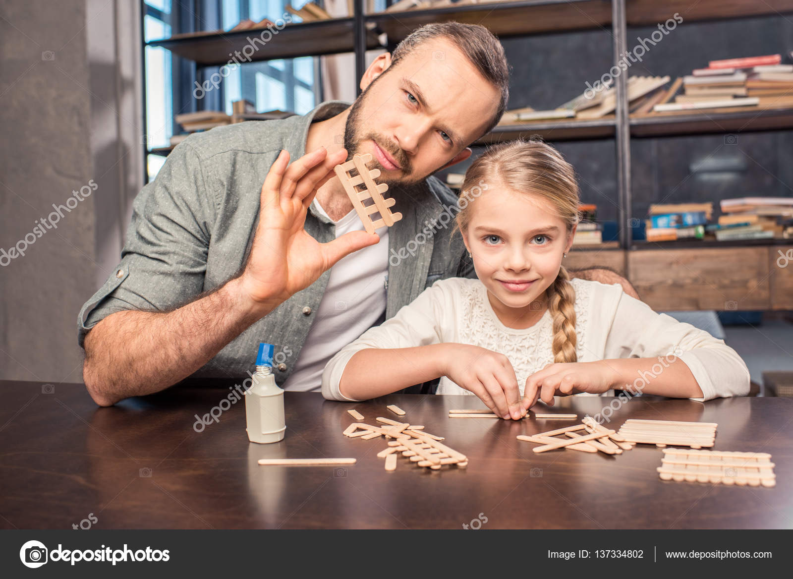 Father and daughter making figure — Stock Photo © IgorTishenko #137334802