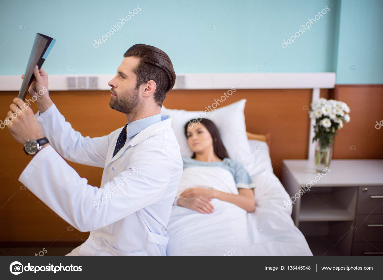 Doctor holding x-ray image — Stock Photo © IgorTishenko #138445948