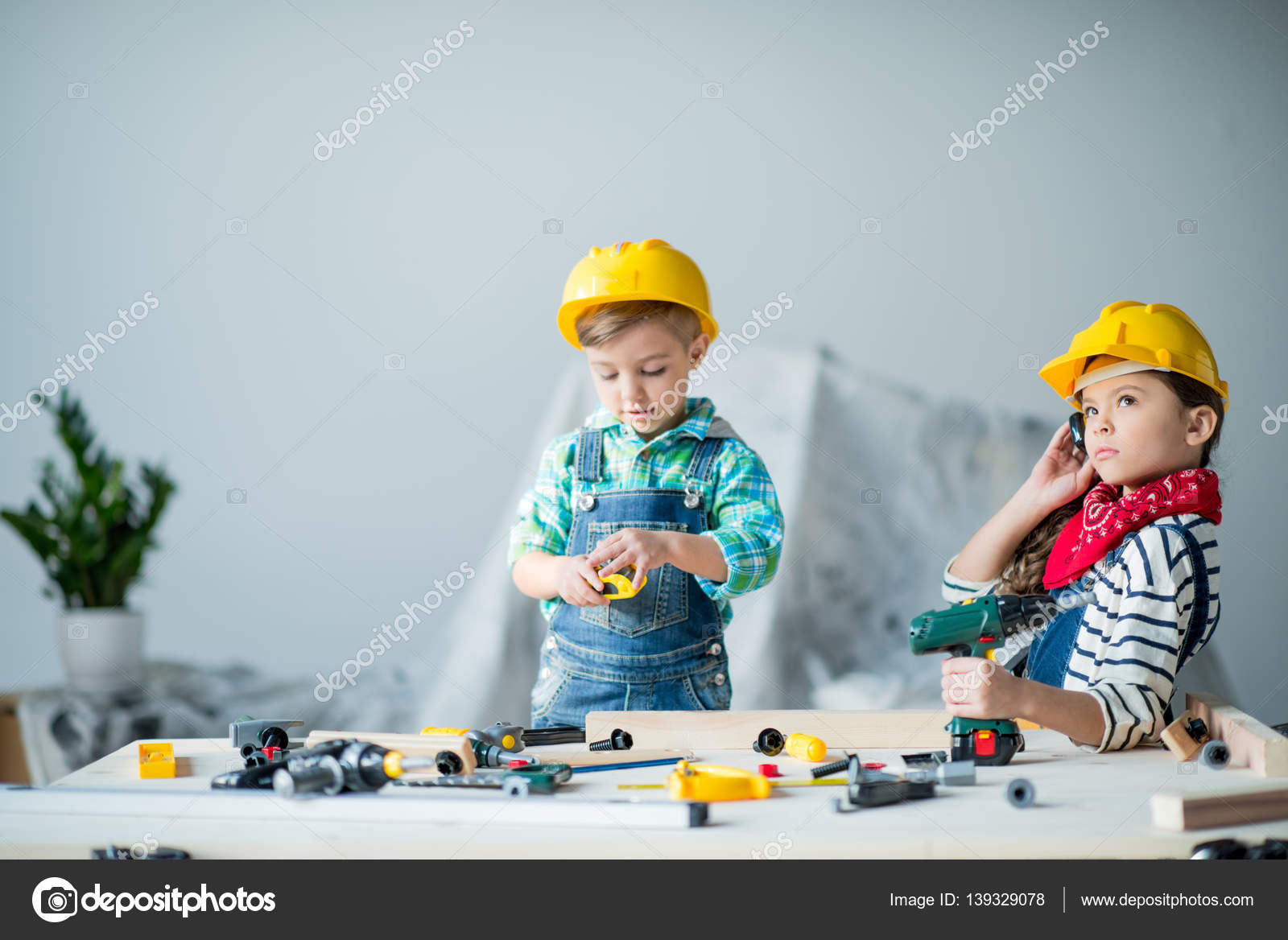 Boy and girl with tools — Stock Photo © IgorTishenko #139329078