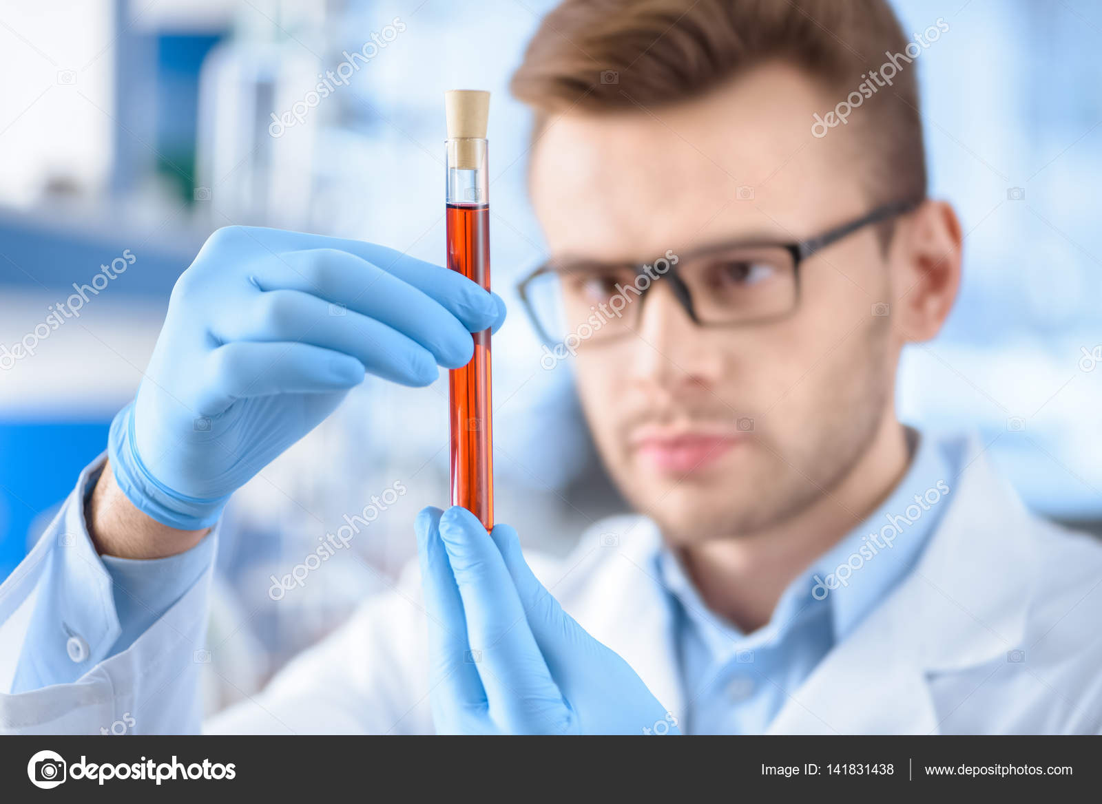 Scientist with laboratory tube Stock Photo by ©IgorTishenko 141831438