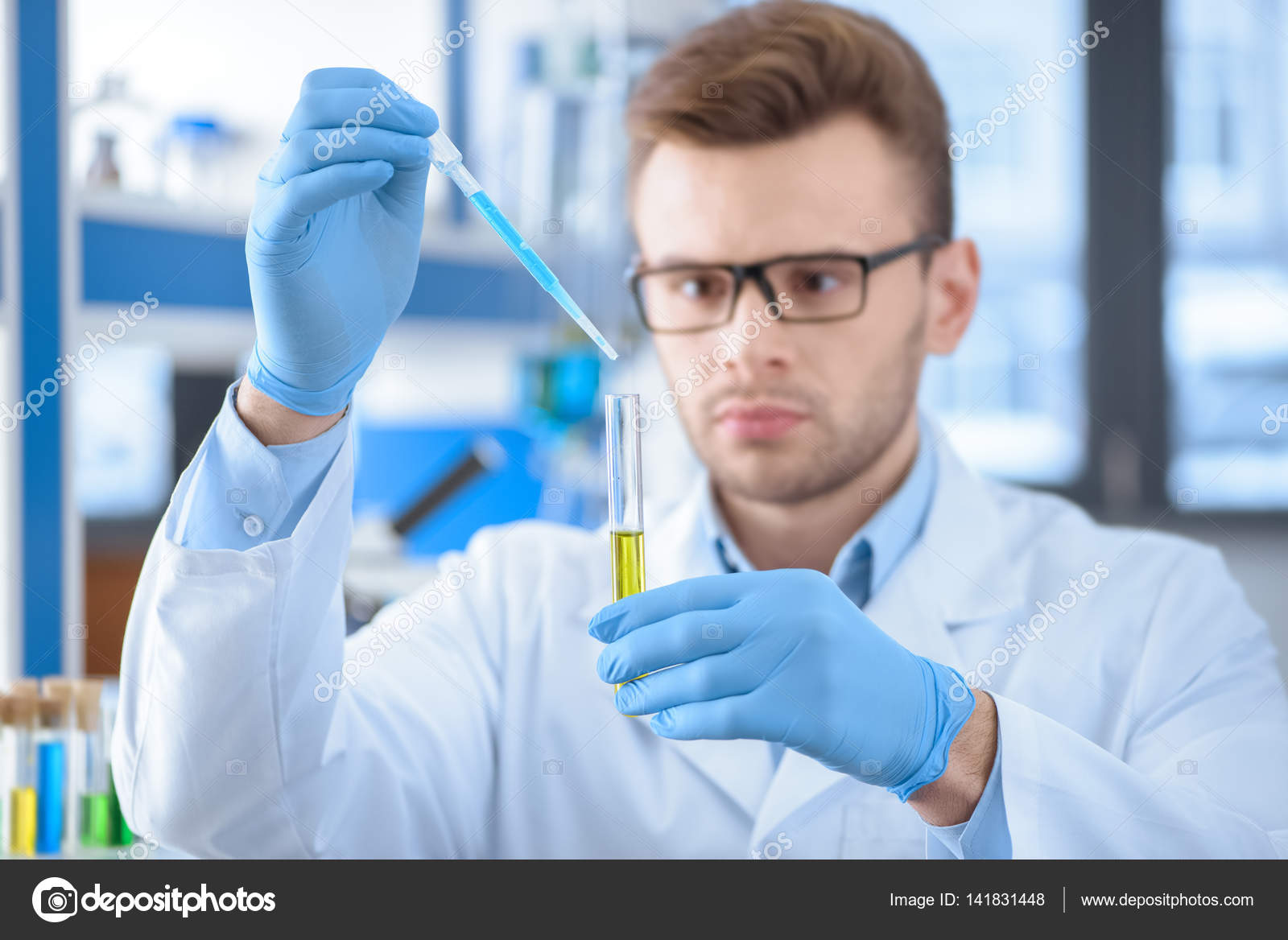 Scientist with laboratory tube — Stock Photo © IgorTishenko #141831448