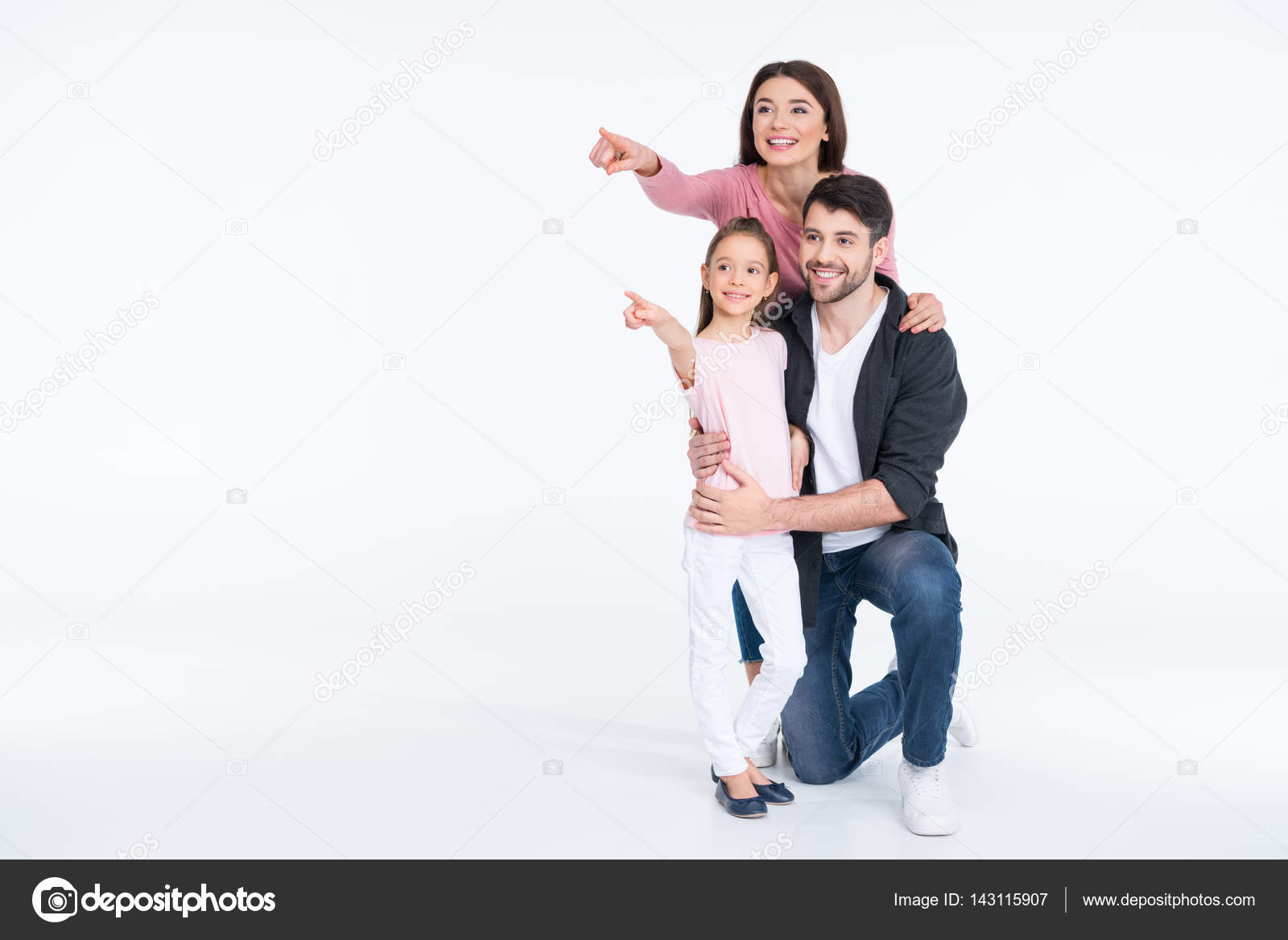 Happy family pointing — Stock Photo © IgorTishenko #143115907 Happy family pointing — Stock Photo © IgorTishenko #143115907
