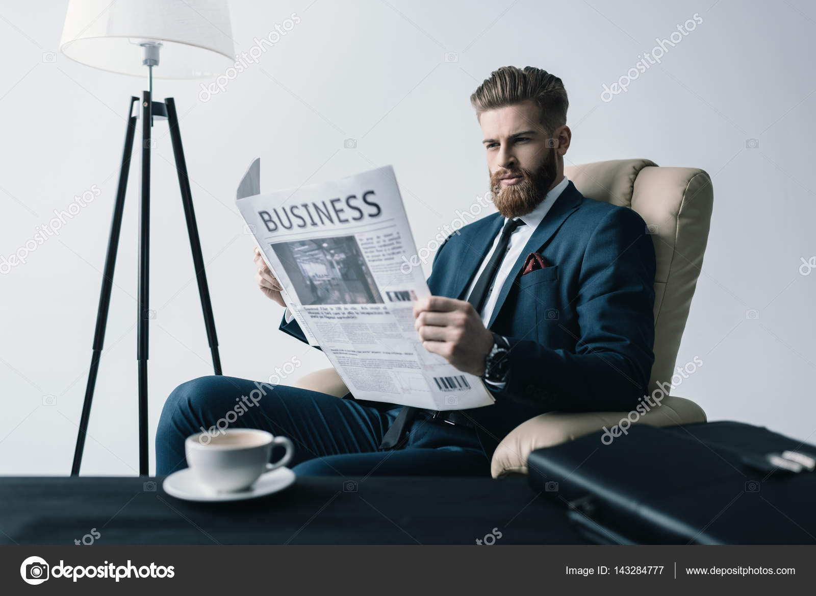 Businessman reading newspaper Stock Photo by ©IgorTishenko 143284777 Businessman reading newspaper Stock Photo by ©IgorTishenko 143284777