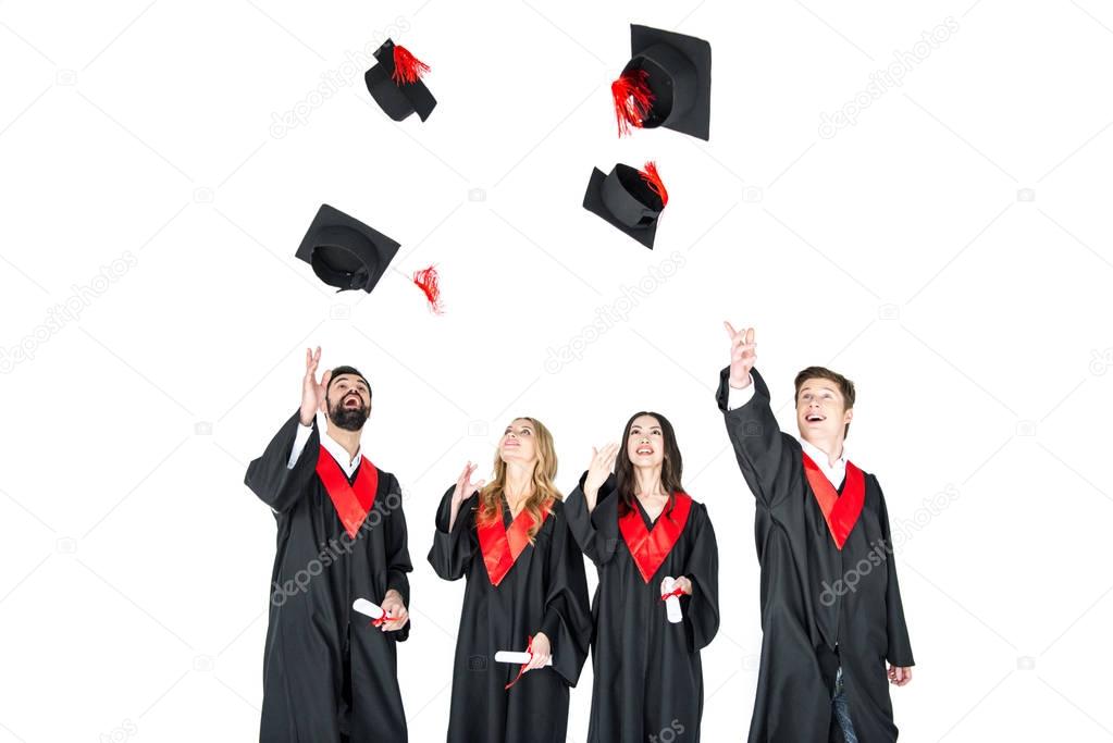 Students throwing graduation caps — Stock Photo © IgorTishenko #148586563