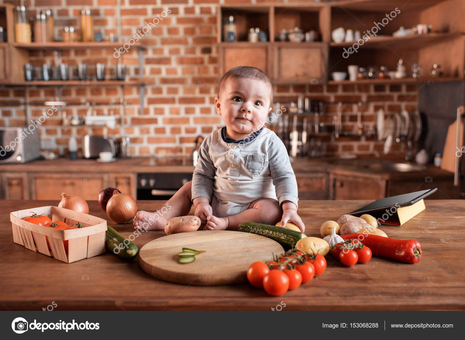 Little boy on kitchen table — Stock Photo © IgorTishenko #153068288