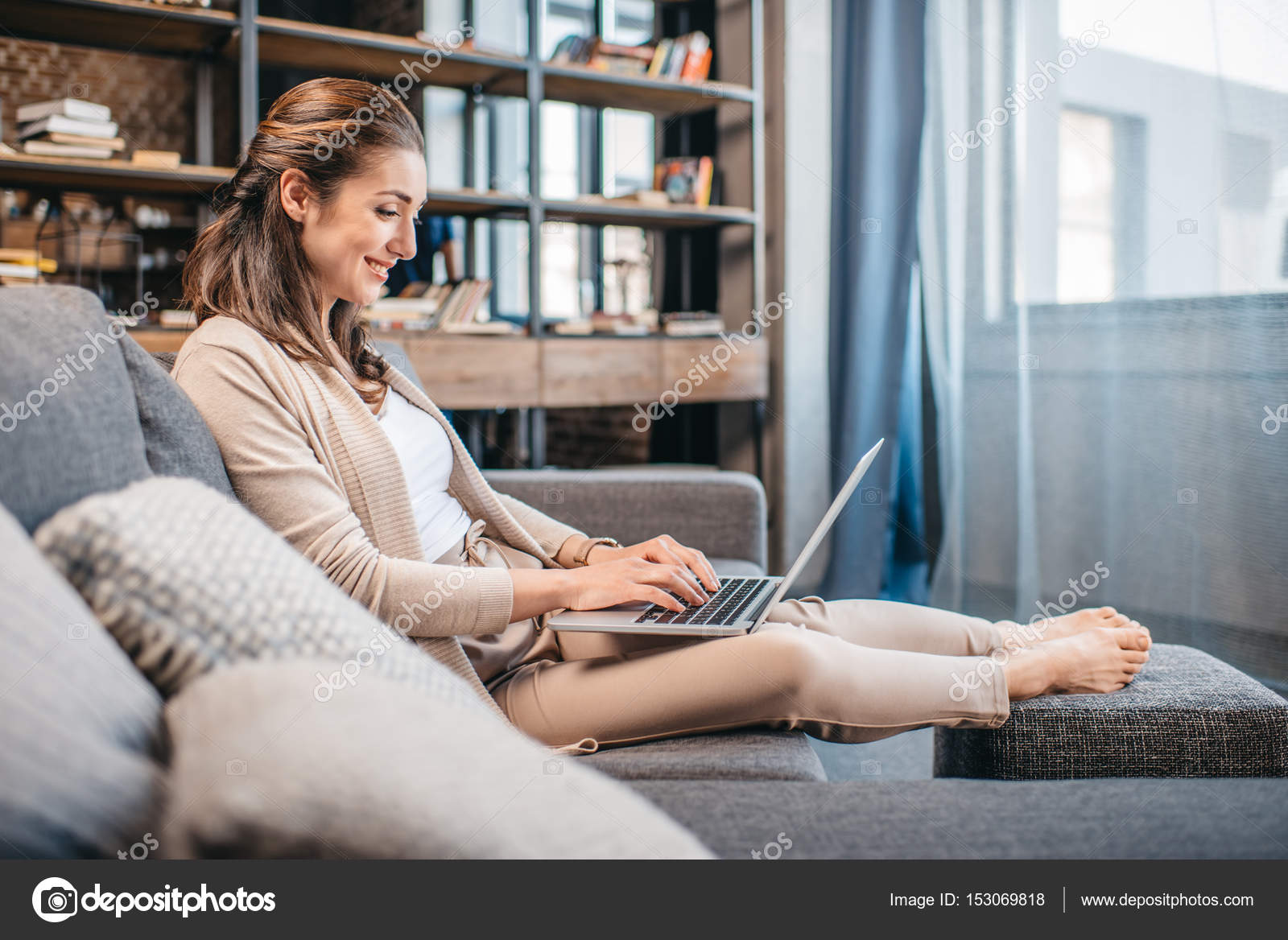 Woman typing on laptop — Stock Photo © IgorTishenko #153069818 Woman typing on laptop — Stock Photo © IgorTishenko #153069818