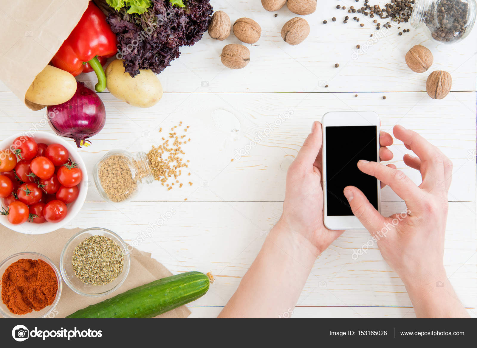 Person using smartphone while cooking — Stock Photo © IgorTishenko ...