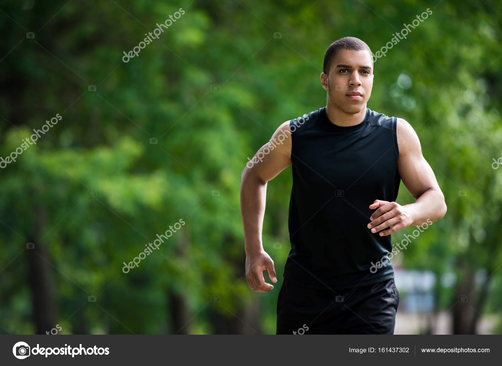 African american sportsman running in park — Stock Photo © IgorTishenko ...