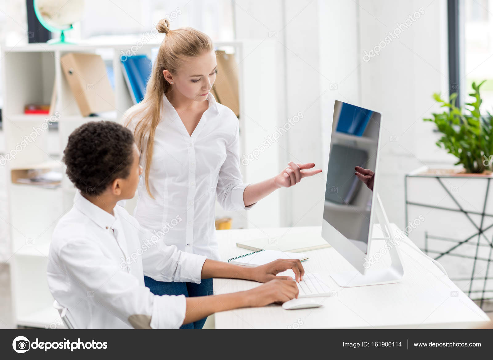 Multicultural students discussing task — Stock Photo © IgorTishenko ...