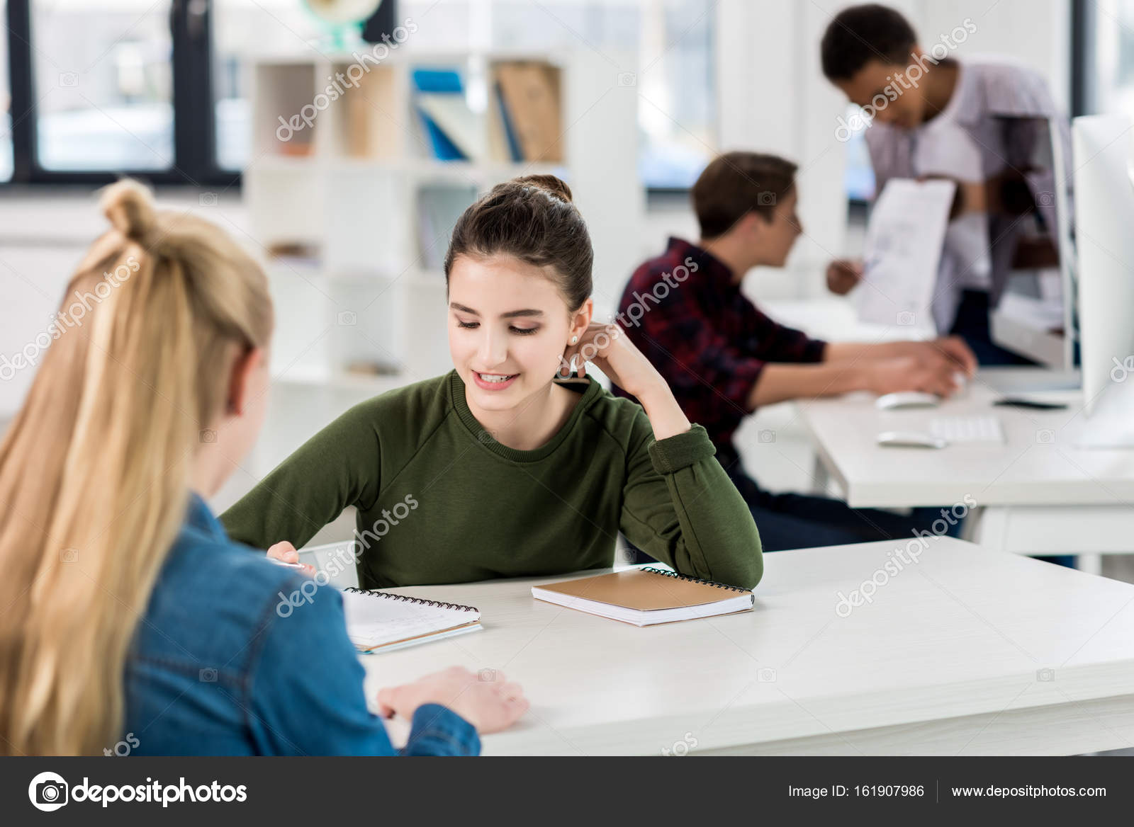 Students studying in class Stock Photo by ©IgorTishenko 161907986