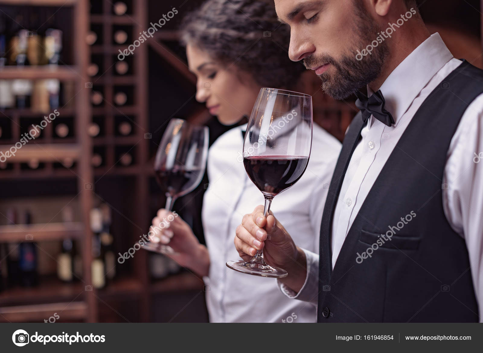 Sommeliers tasting wine in cellar — Stock Photo © IgorTishenko #161946854