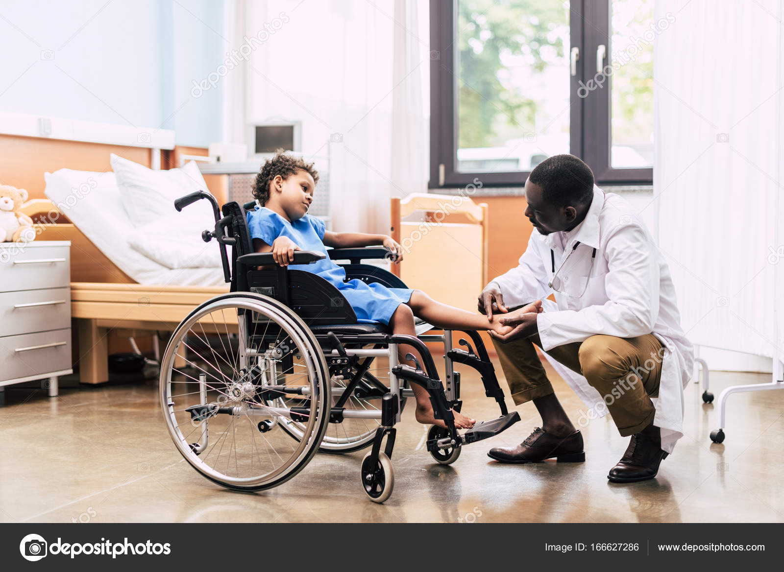 African american doctor and disabled patient Stock Photo by ...