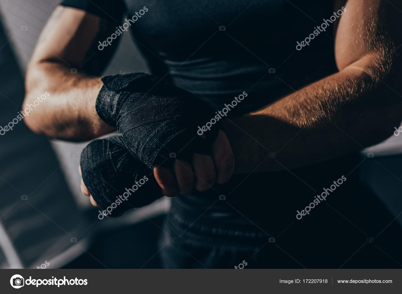 Boxer wrapping hands with bandages — Free Stock Photo © IgorTishenko ...