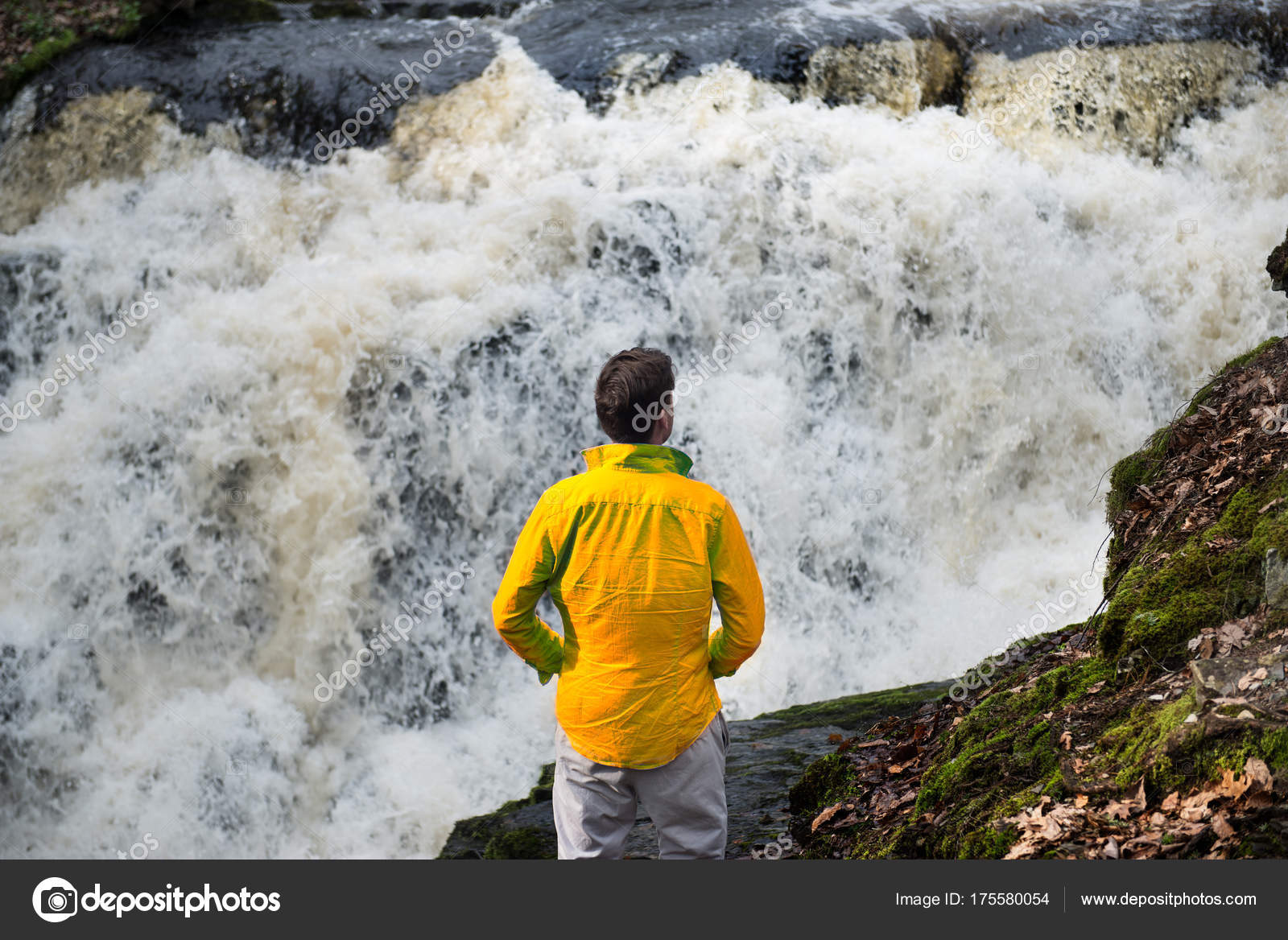 Man Standing Cliff Waterfall Thinking — Stock Photo © JANIFEST #175580054