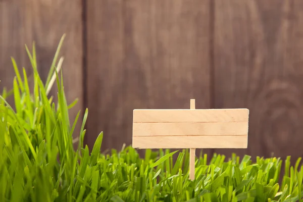 Signboard Spring on Grass background of wood planks, with butter Stock ...