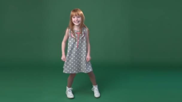 Cute little ginger girl dancing and fooling around — Stock Video ...