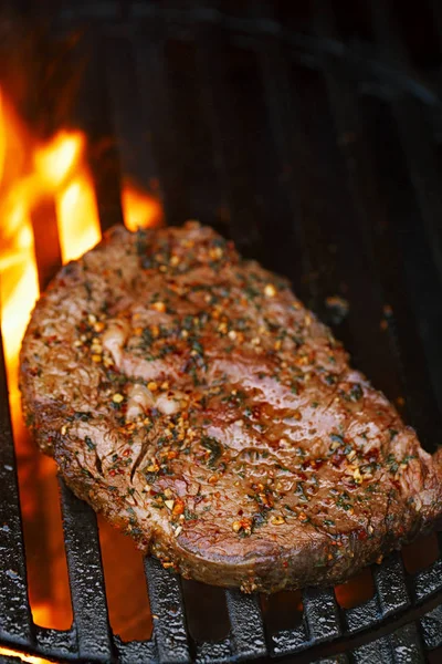 ribeye rib eye roast beef steak on bbq barbecue grill with flame ...