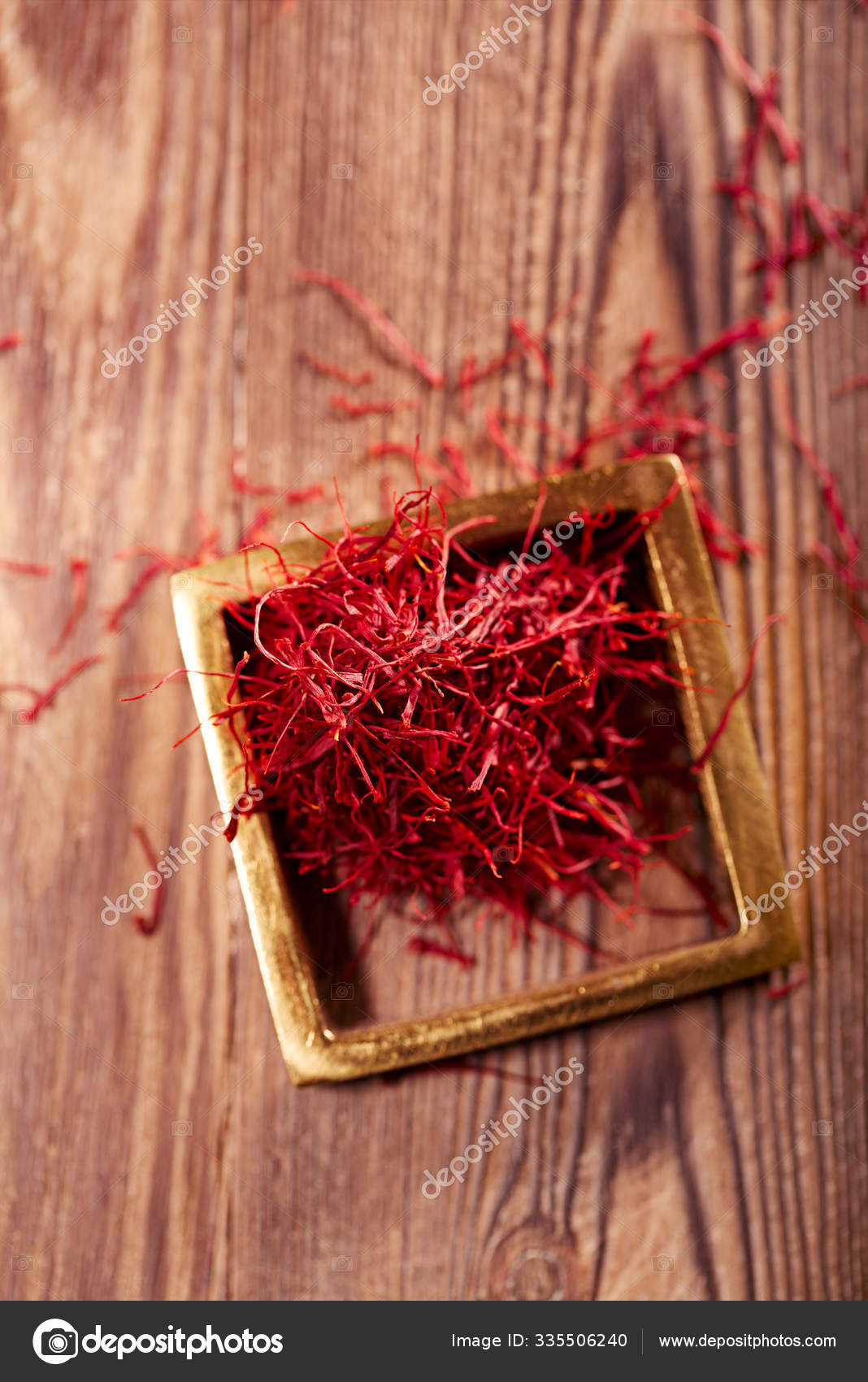 Saffron threads pile with vintage wood backdrop Stock Photo by ©lvenks ...