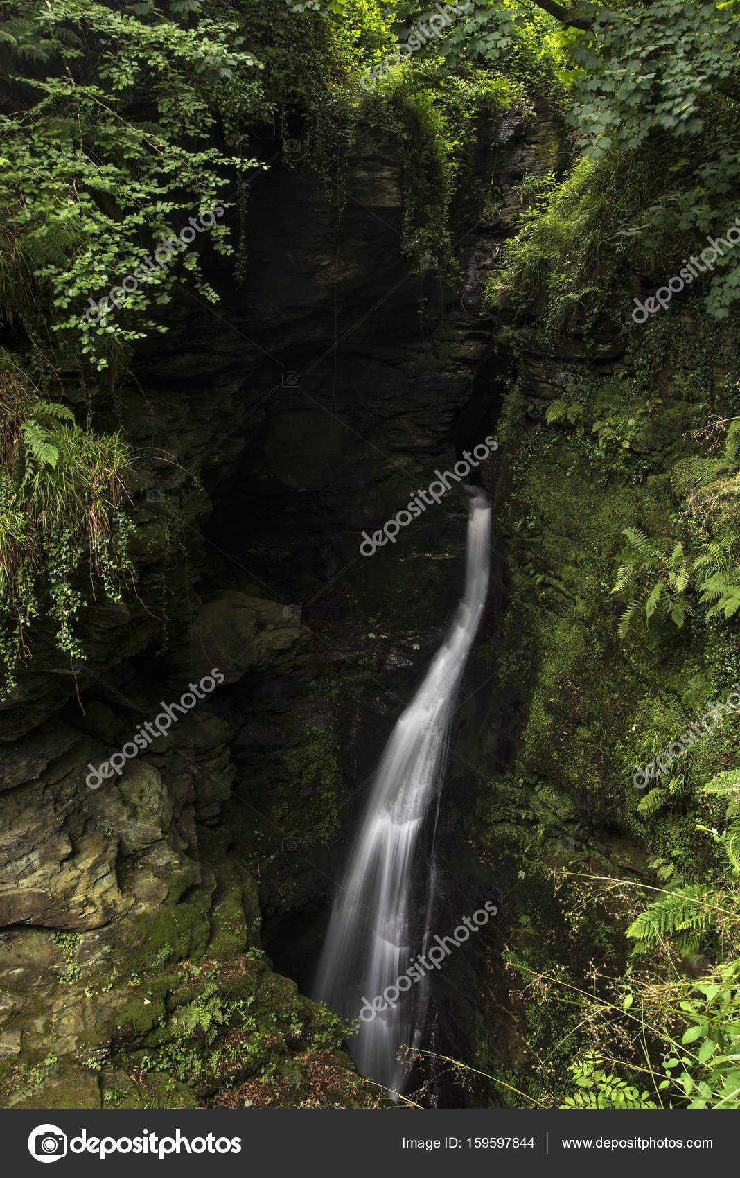 Beautiful flowing waterfall with magical fairytale feel in lush — Stock ...