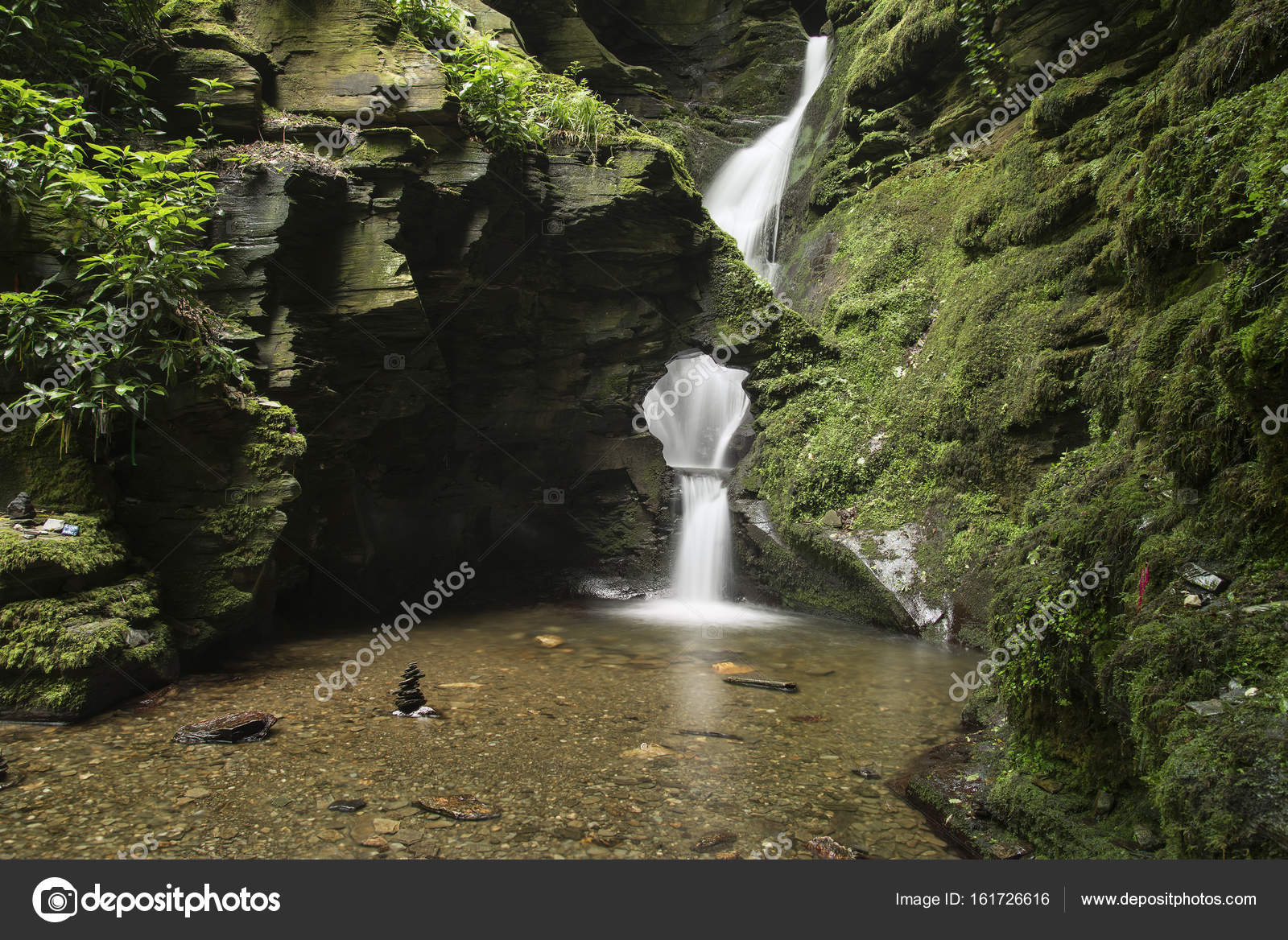 Beautiful flowing waterfall with magical fairytale feel in lush — Stock ...