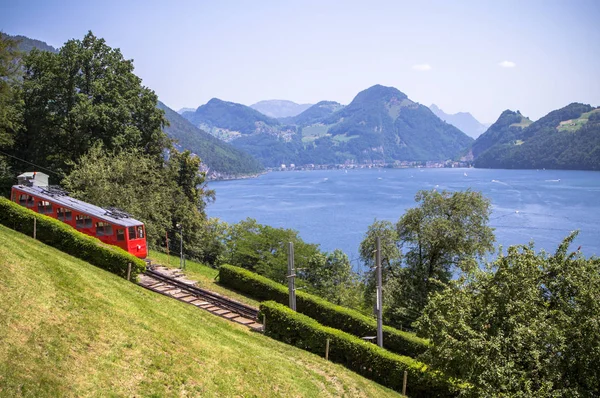 Red cogwheel train in, Lucerne, Switzerland – Stock Editorial Photo ...