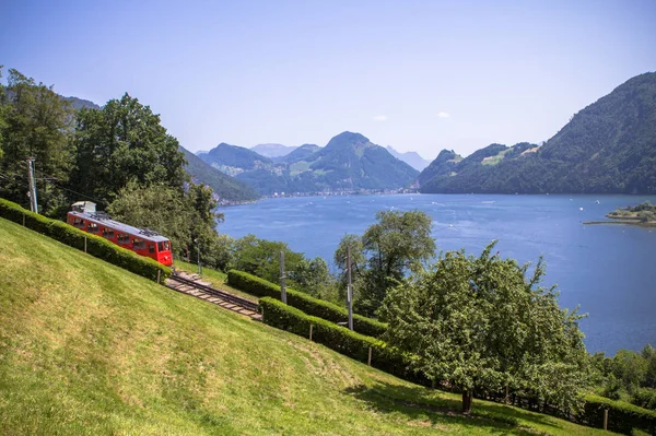 Red cogwheel train in, Lucerne, Switzerland – Stock Editorial Photo ...