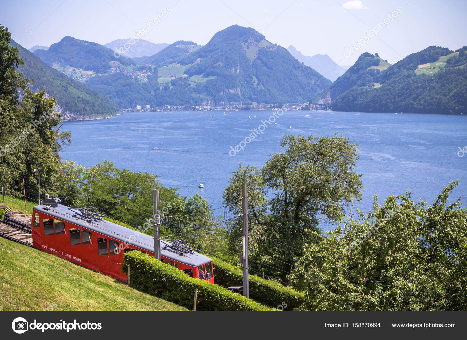 Red cogwheel train in, Lucerne, Switzerland – Stock Editorial Photo ...