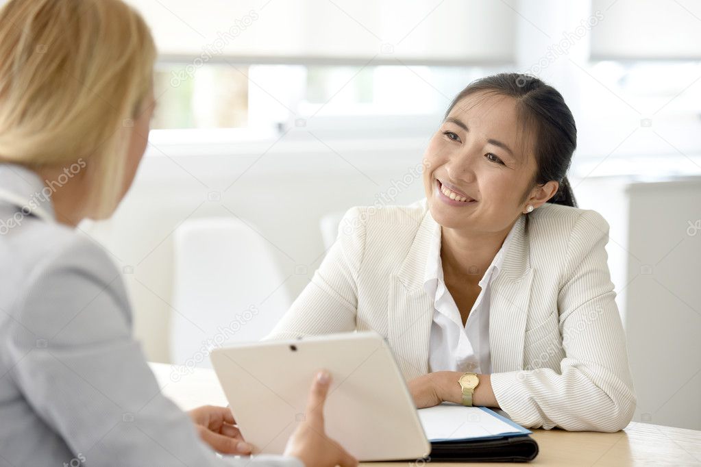 Businesswomen meeting for partnership — Stock Photo © Goodluz #126592812 Businesswomen meeting for partnership — Stock Photo © Goodluz #126592812