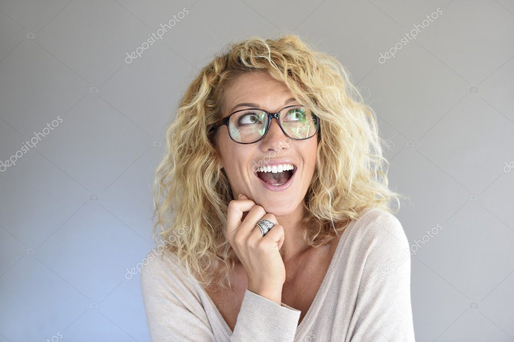Woman with eyeglasses on being expressive — Stock Photo © Goodluz ...