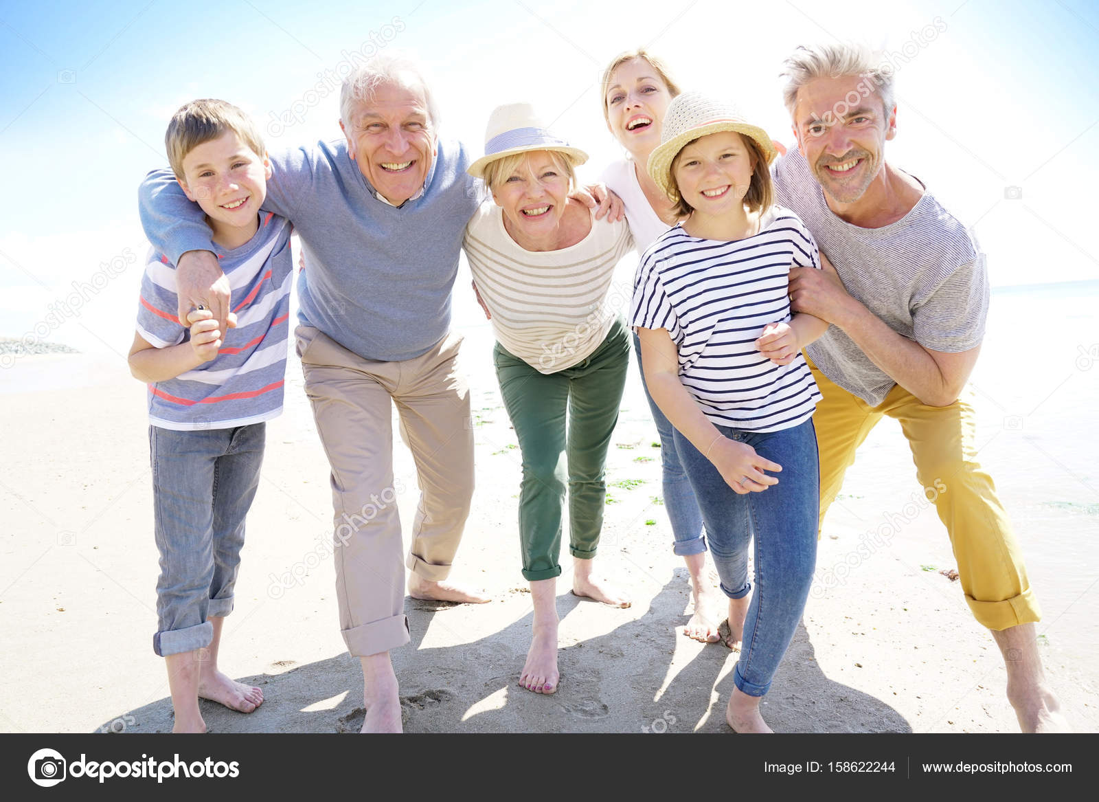 Happy intergenerational family Stock Photo by ©Goodluz 158622244