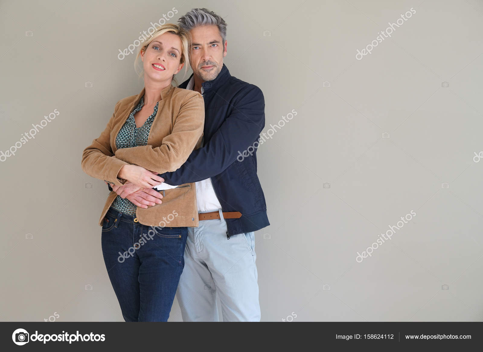Middle-aged couple standing — Stock Photo © Goodluz #158624112