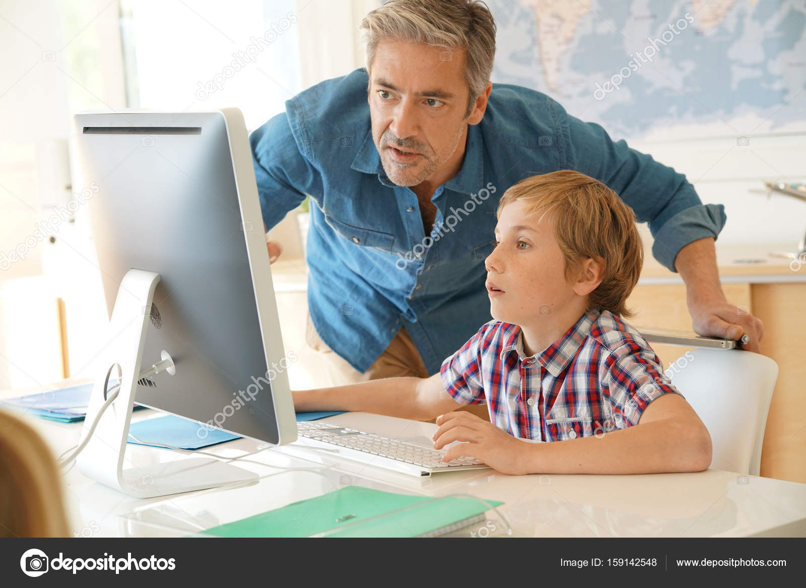 Schoolboy in computer lab Stock Photo by ©Goodluz 159142548
