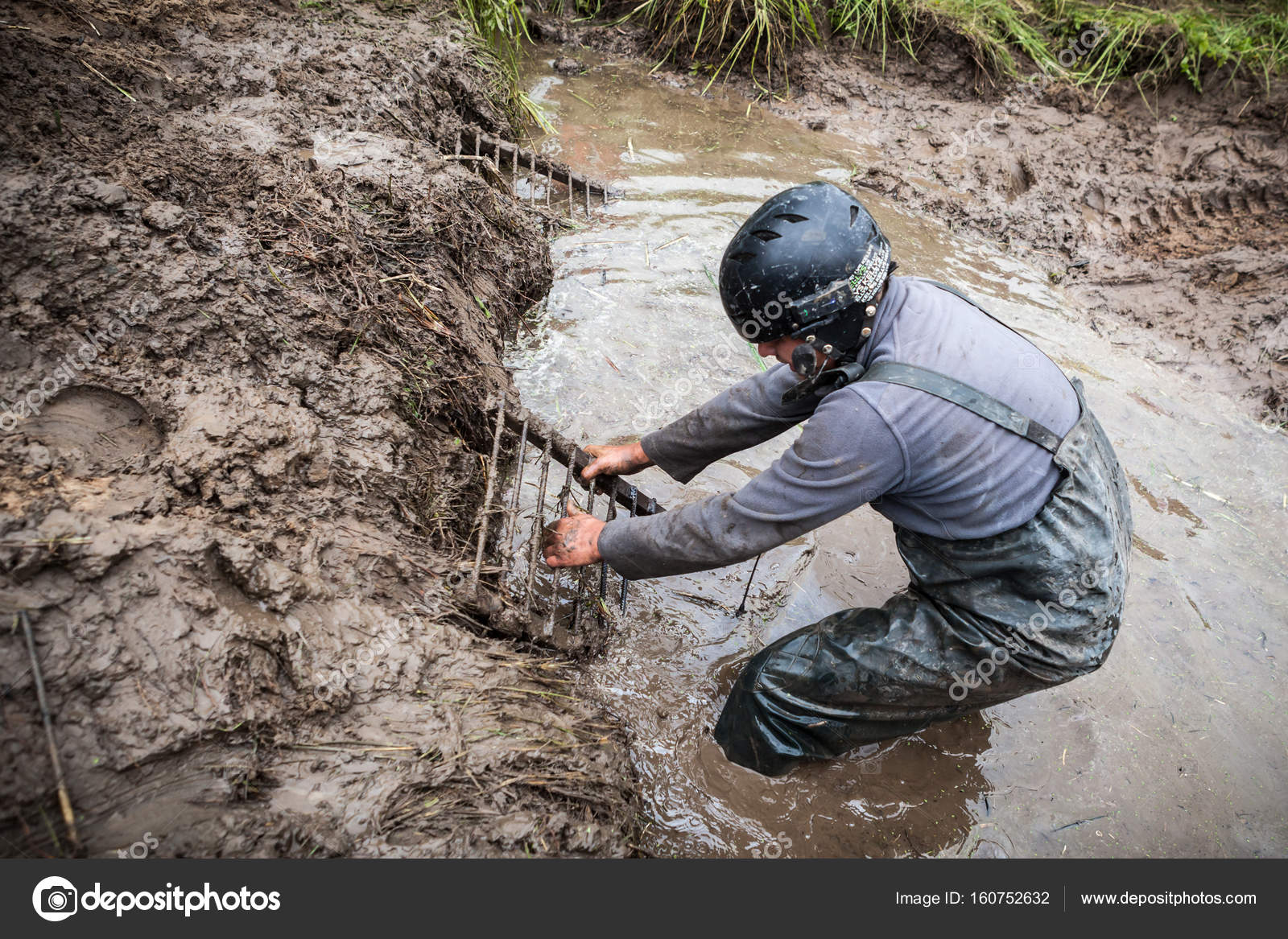 Pilot tries to get recovery sand tracks from deep mud. – Stock ...