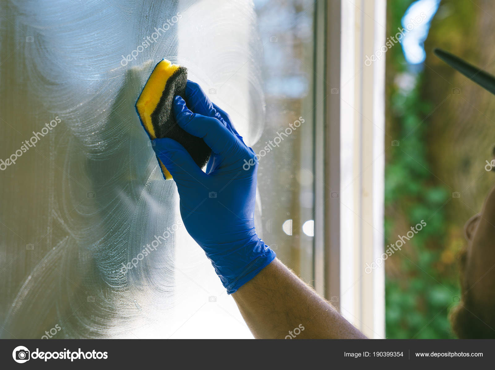 Young Man Using Rag Squeegee While Cleaning Windows Professional Window ...