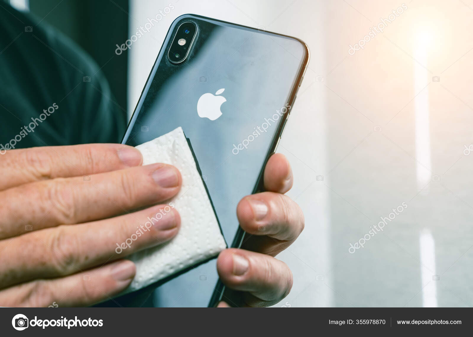 Person Cleaning Apple Iphone Mobile Phone Screen Disinfecting Wipes ...