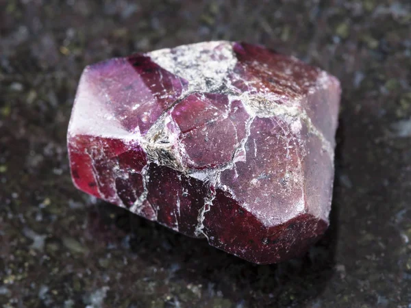 raw crystal of red garnet gemstone on dark - Stock Image - Everypixel