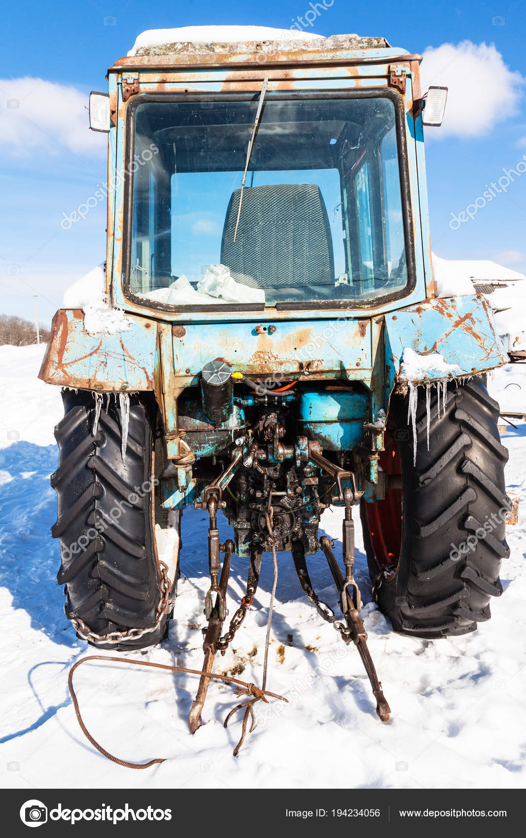 Broken tractor on snowy road in sunny winter day Stock Photo by ...