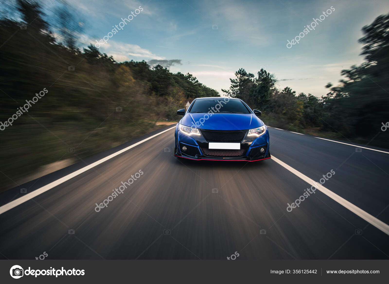 Blue sport car front view drive on the road — Stock Editorial Photo ...