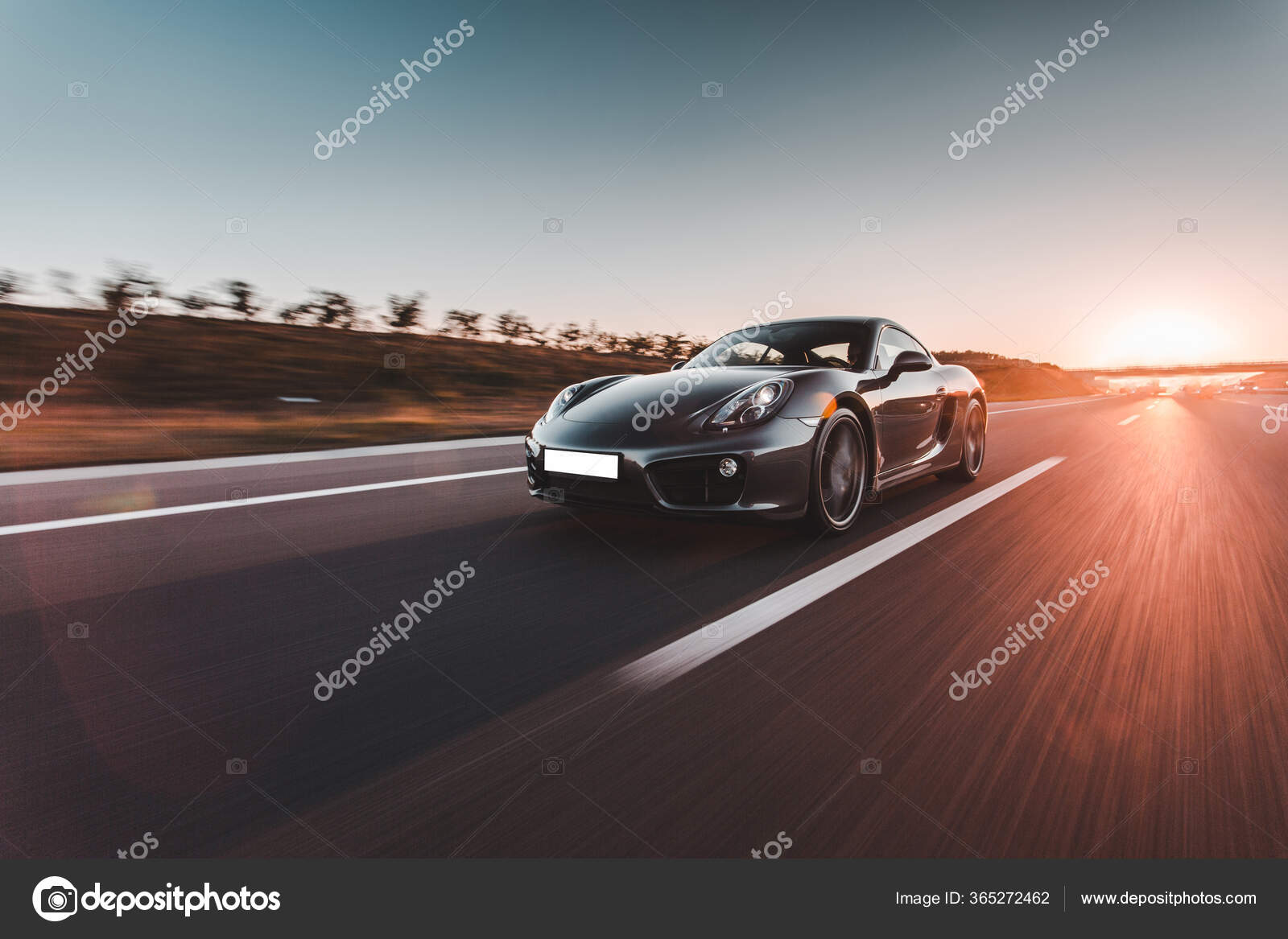Navy blue sport car speed drive on the autobahn in the sunset — Stock ...
