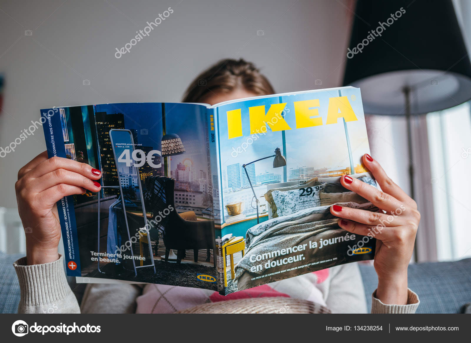Woman reading IKEA catalog – Stock Editorial Photo © ifeelstock #134238254