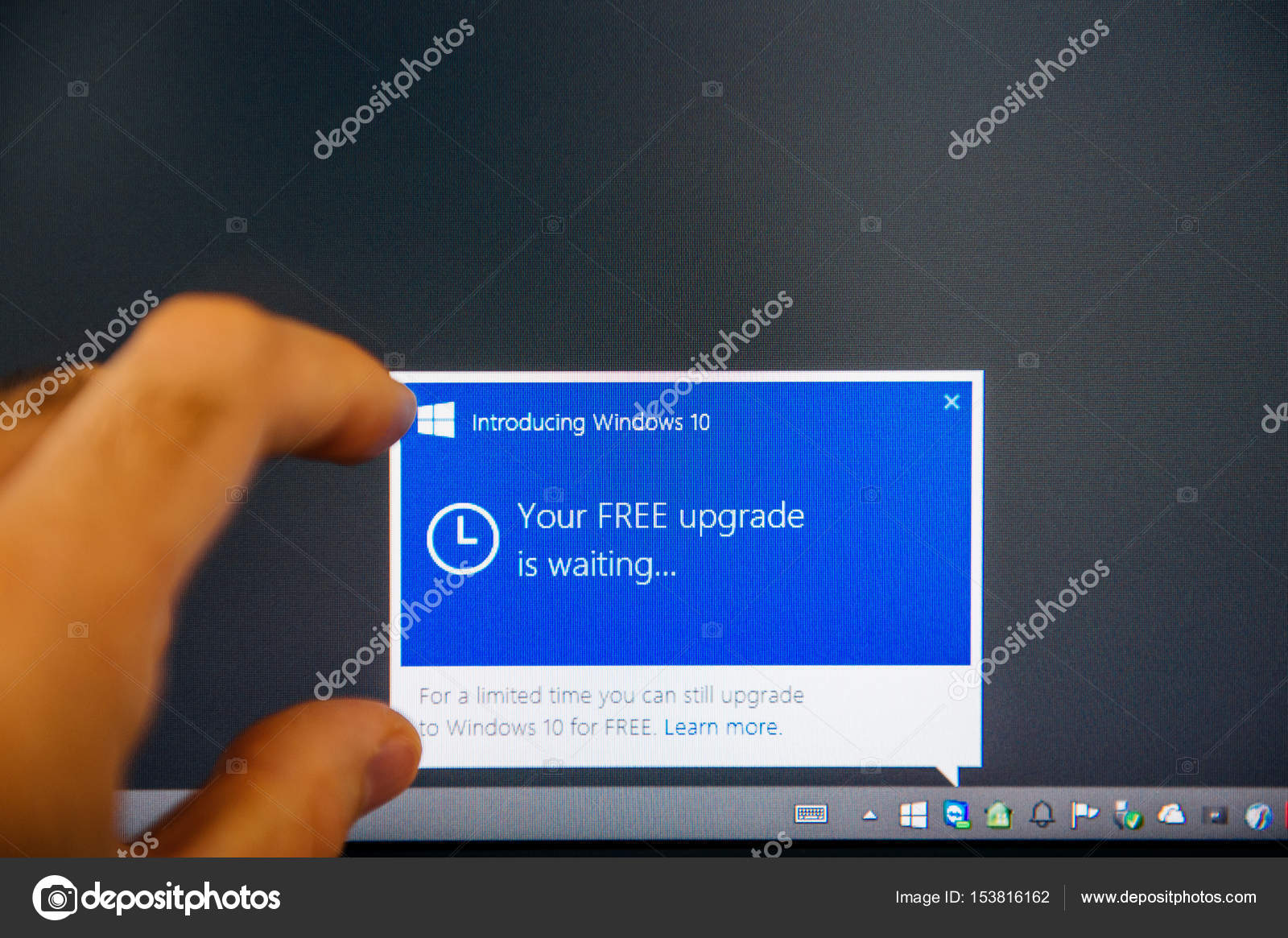 Introducing Windows 10 message on computer display man touching — Stock ...