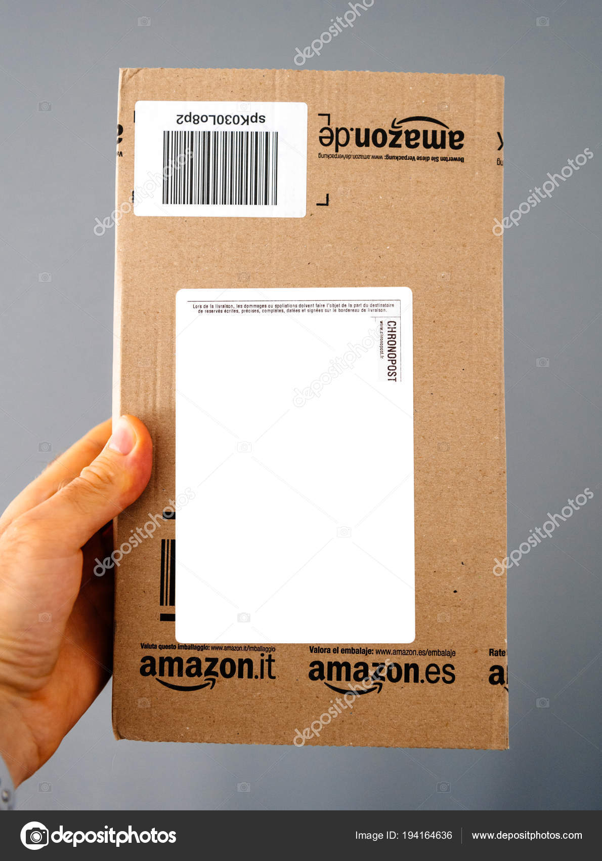 Man holding Amazon PArcel box — Stock Editorial Photo © ifeelstock ...
