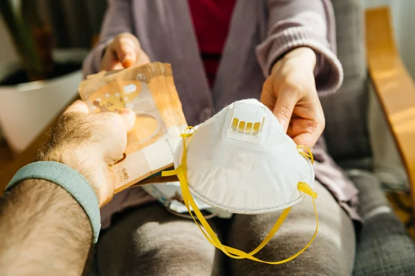 Man offering stack of money banknotes for surgical procedure medical ...