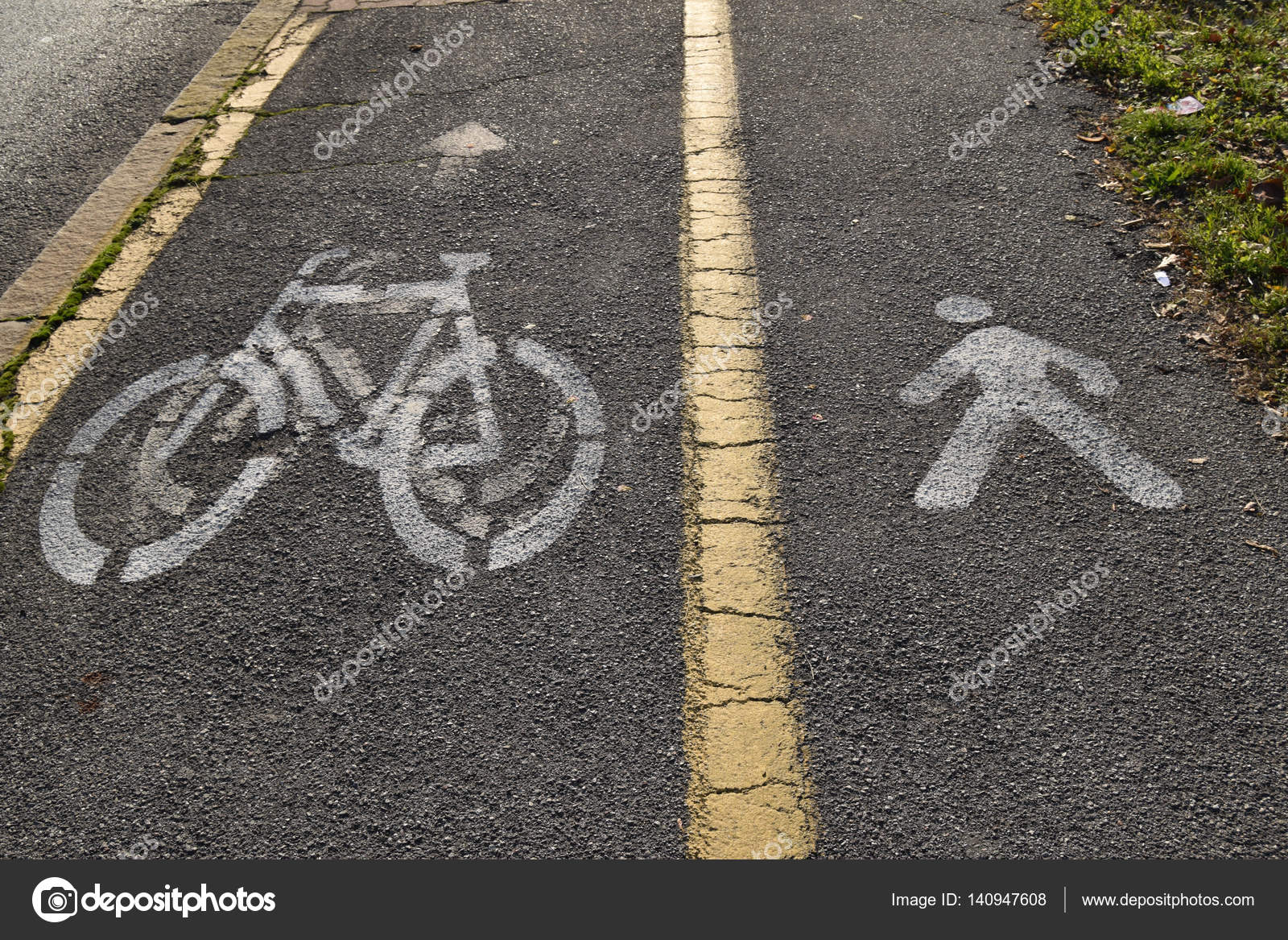 Bike path and pedestrian space along a suburban street Stock Photo by ...