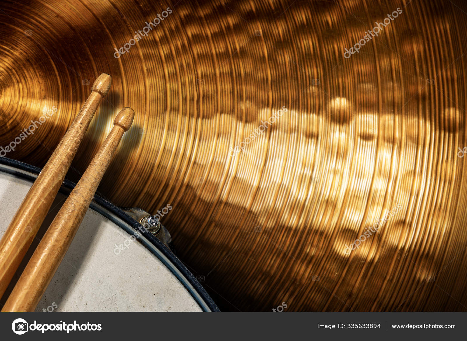 Two wooden drumsticks on a snare drum and golden cymbal - Percussion ...